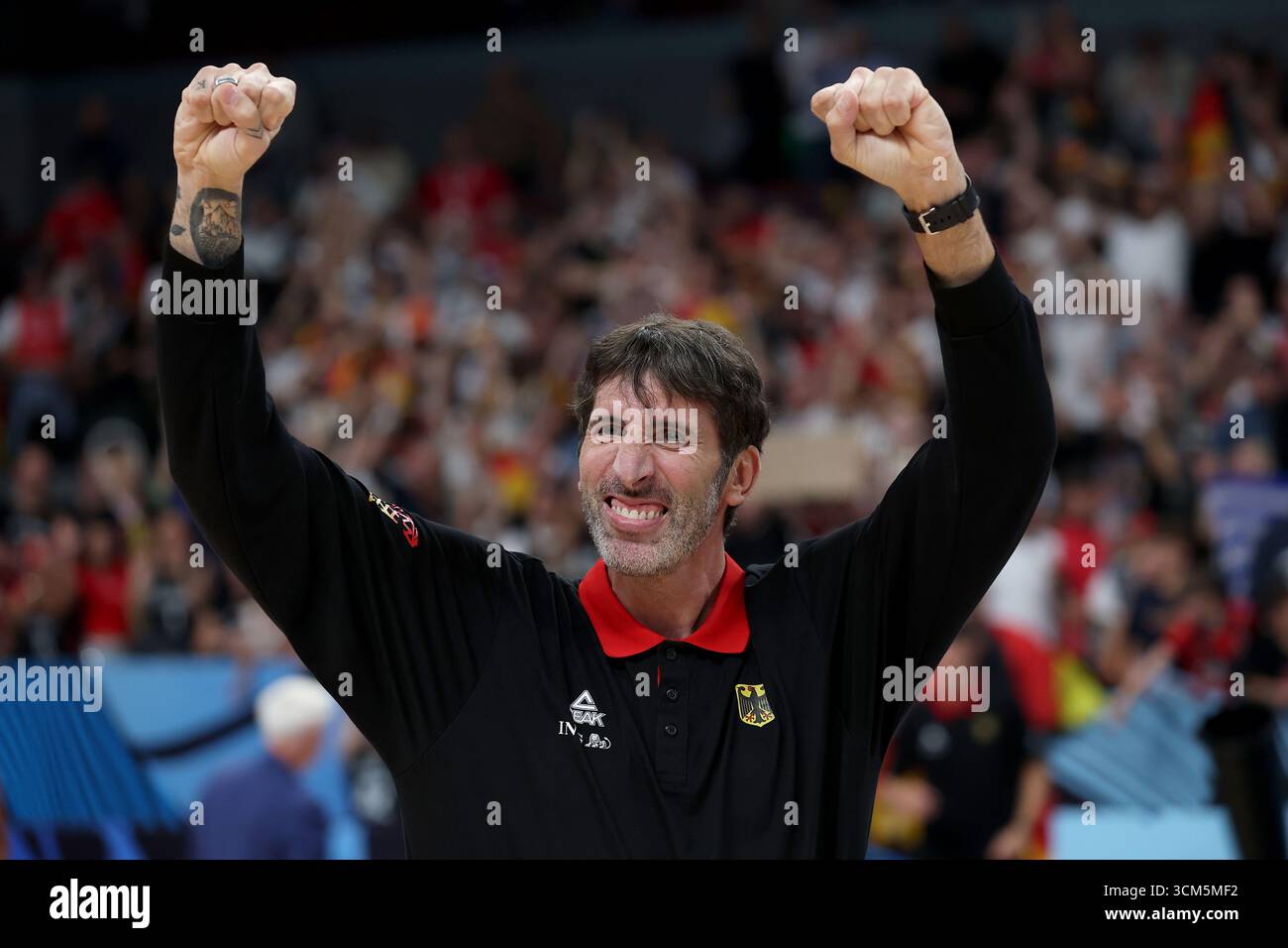 Germany's head coach Alex Mumbru celebrates during FIBA Eurobasket 2025 ...