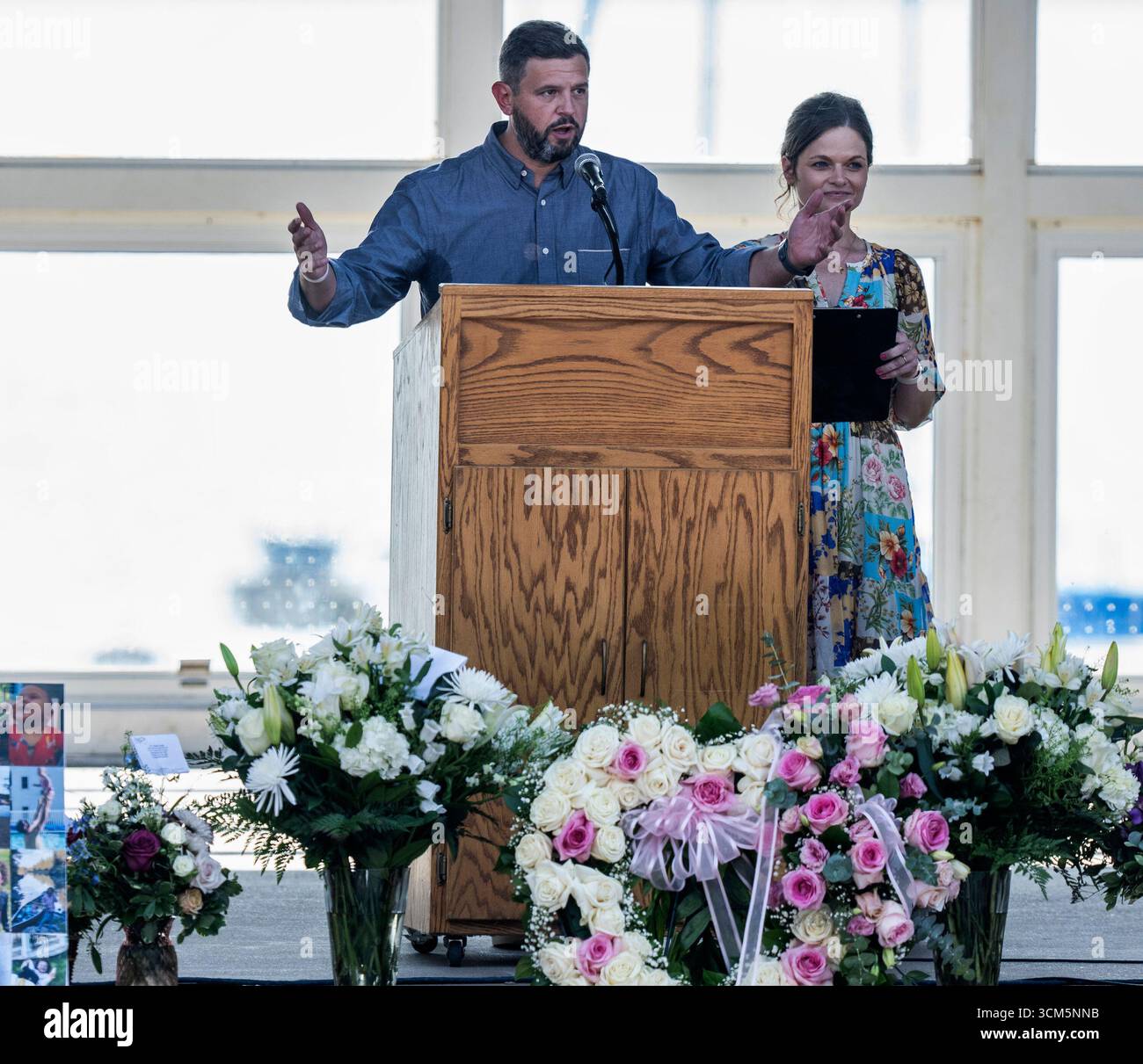 Parents Mike Moyski and Jackie Flavin thank the attendees who gathered for the celebration of ...