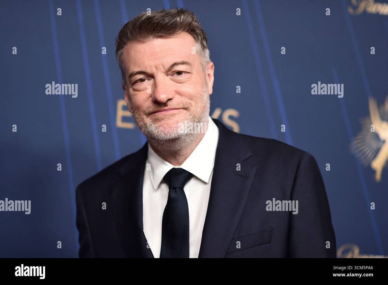 Charlie Brooker arrives at the 77th Primetime Emmy Awards on Sunday ...