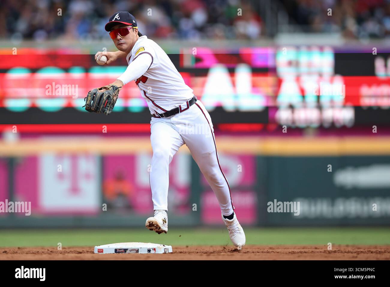 Atlanta Braves shortstop Ha-Seong Kim turns a double play in the third ...