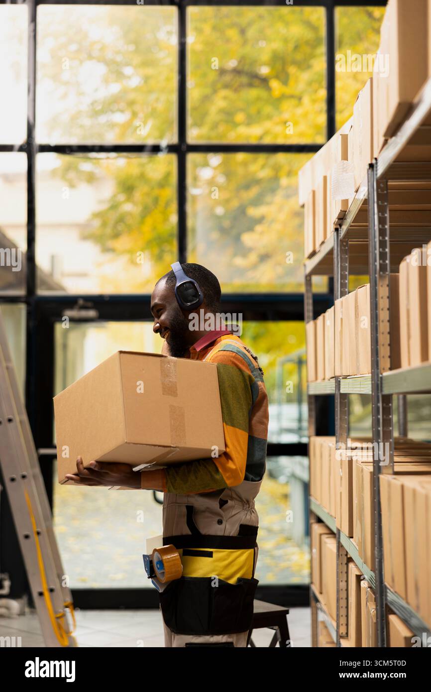 African american man handling inventory operations in a small-scale ...