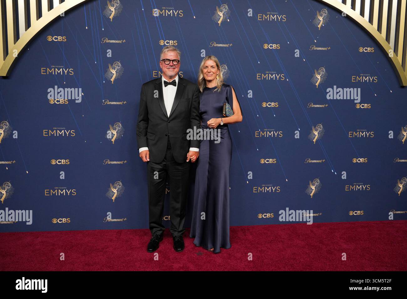 Alex Graves, left, and Lilly Graves arrive at the 77th Emmy Awards on ...