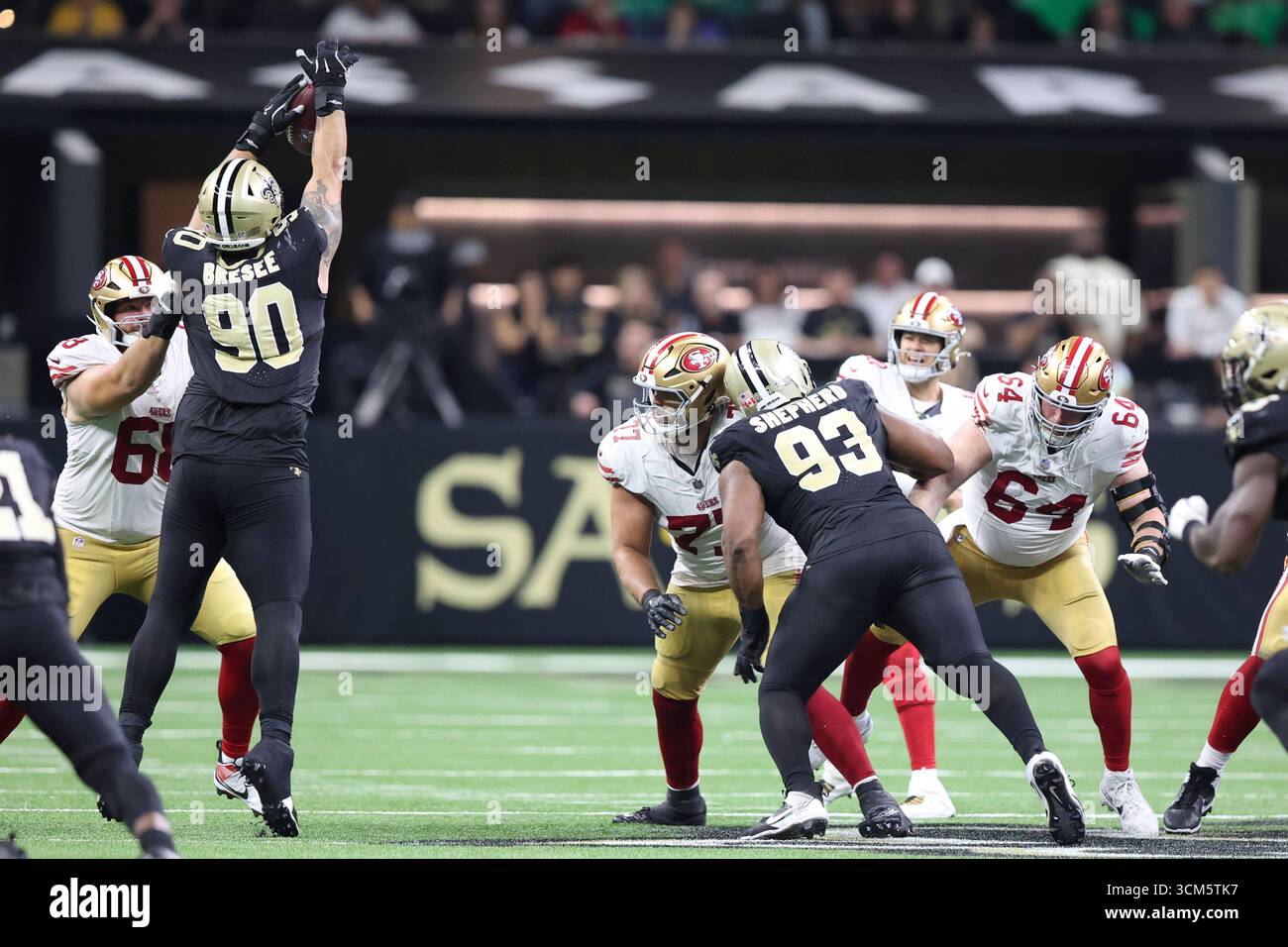 New Orleans Saints defensive tackle Bryan Bresee (90) breaks up a pass ...