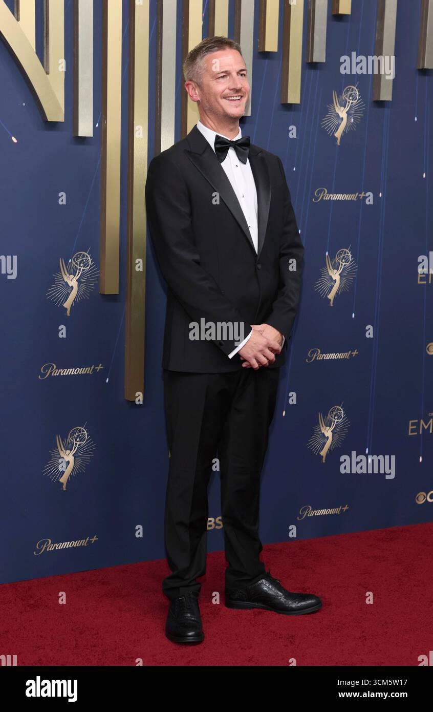 Mark Kinsella arrives at the 77th Emmy Awards on Sunday, Sept. 14, 2025 ...