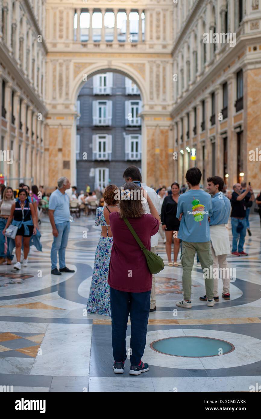 Naples, Italy - September 12, 2025: A girl takes a photo of the ...