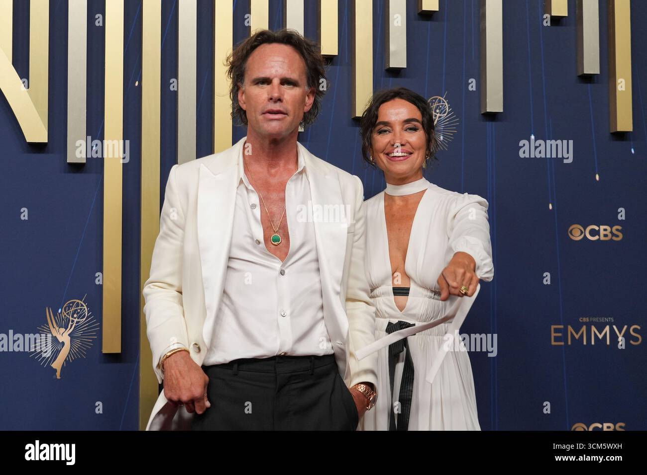 Walton Goggins, left, and Nadia Conners arrive at the 77th Primetime ...