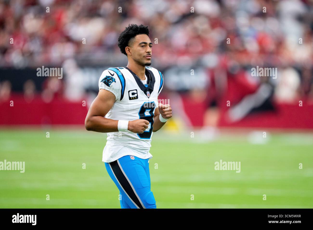 Carolina Panthers quarterback Bryce Young (9) runs with his helmet off ...