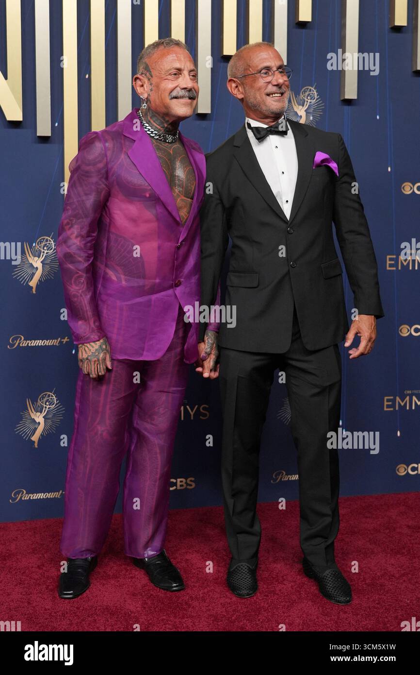 Brad Carpenter, left, and Chris Arruda arrive at the 77th Primetime ...