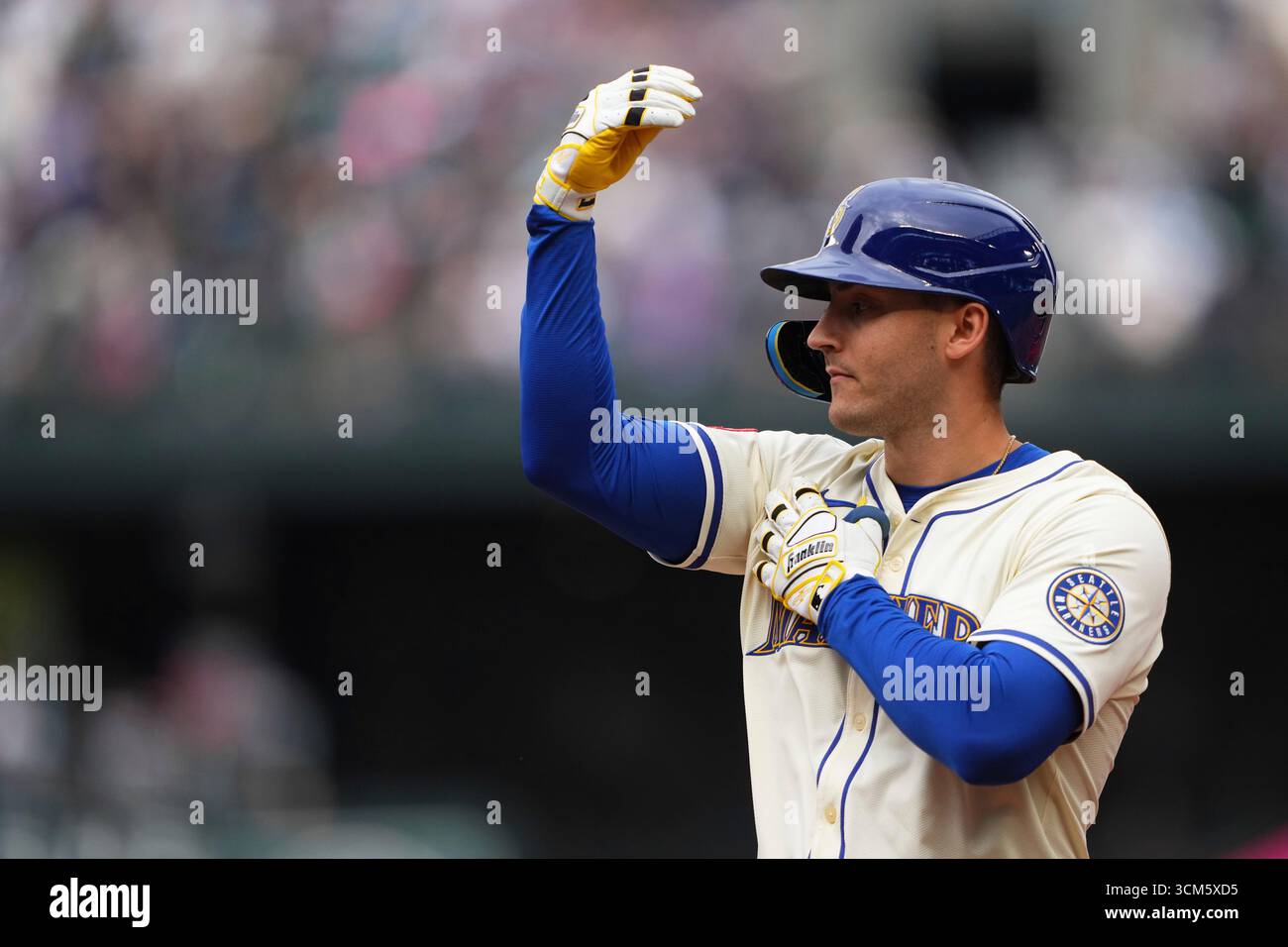 Seattle Mariners' Dominic Canzone reacts to hitting a two-run single to ...