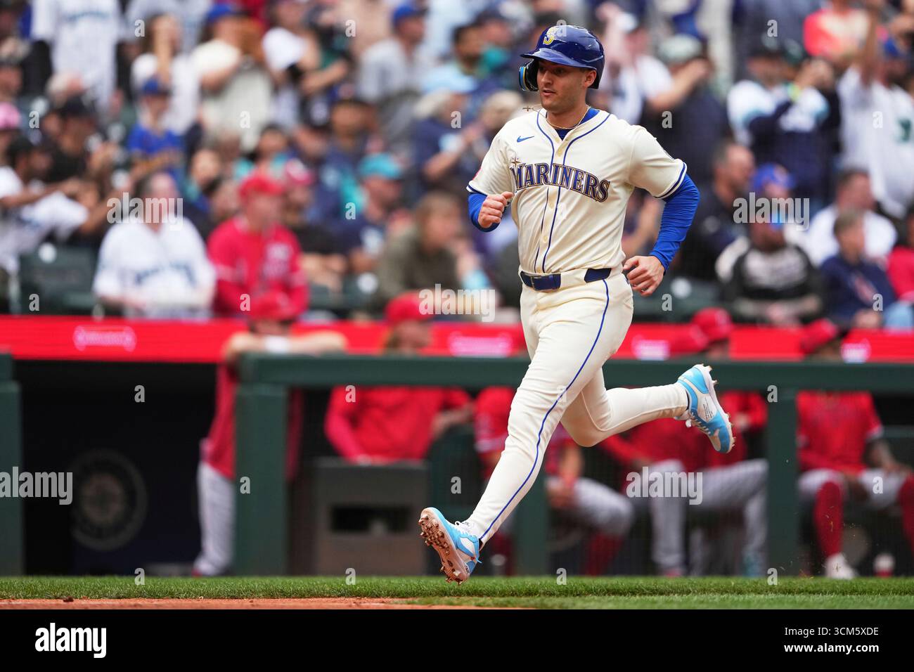 Seattle Mariners' Dominic Canzone scores on an RBI double from J.P ...