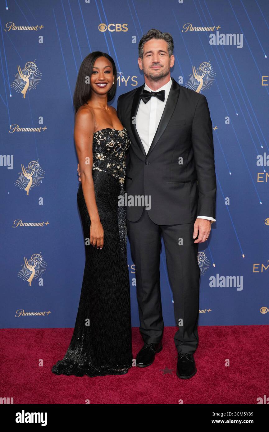 Danielle Acoff, left, and Vladimir Cvetko arrive at the 77th Emmy ...
