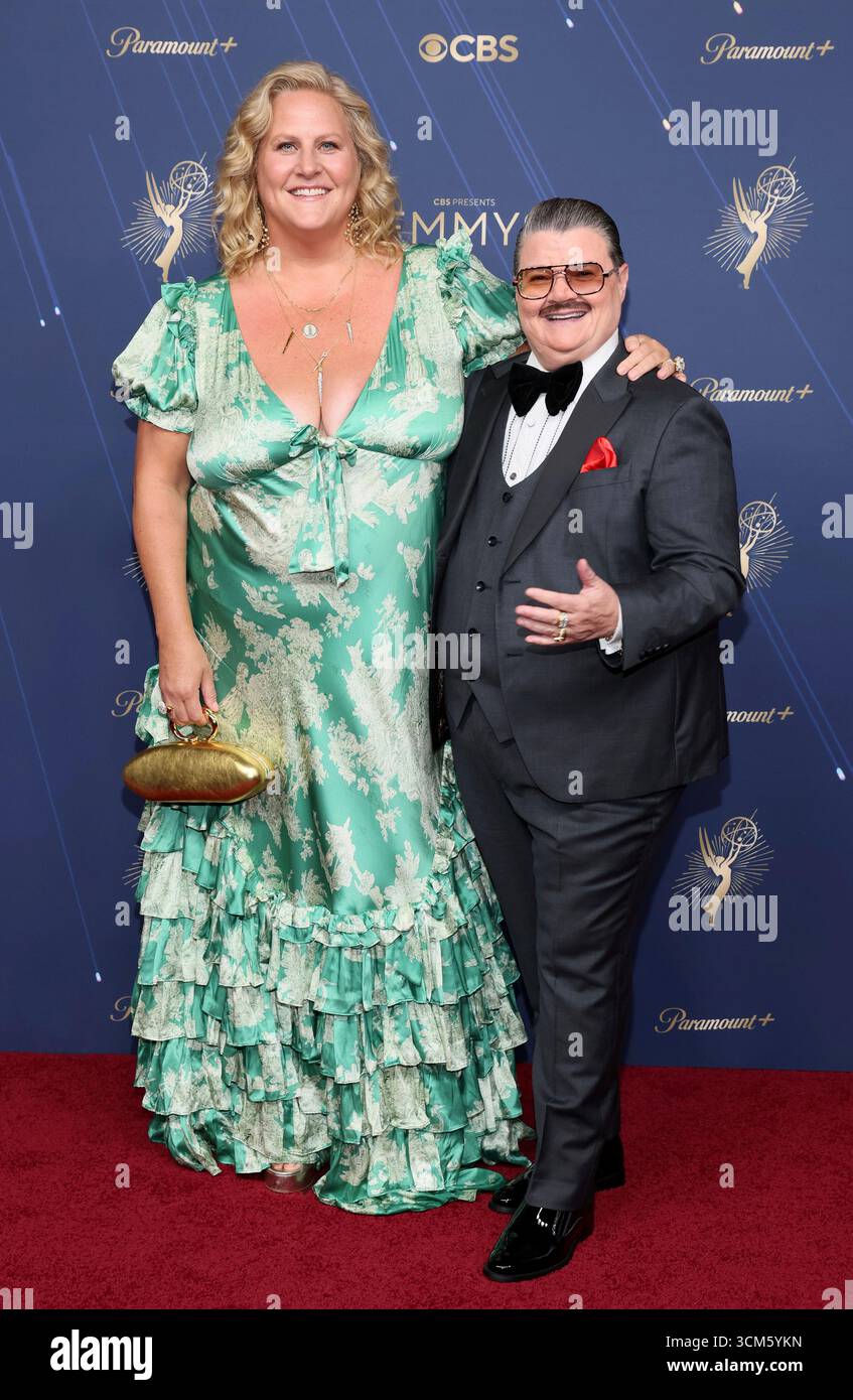 Bridget Everett, left, and Murray Hill arrive at the 77th Emmy Awards ...