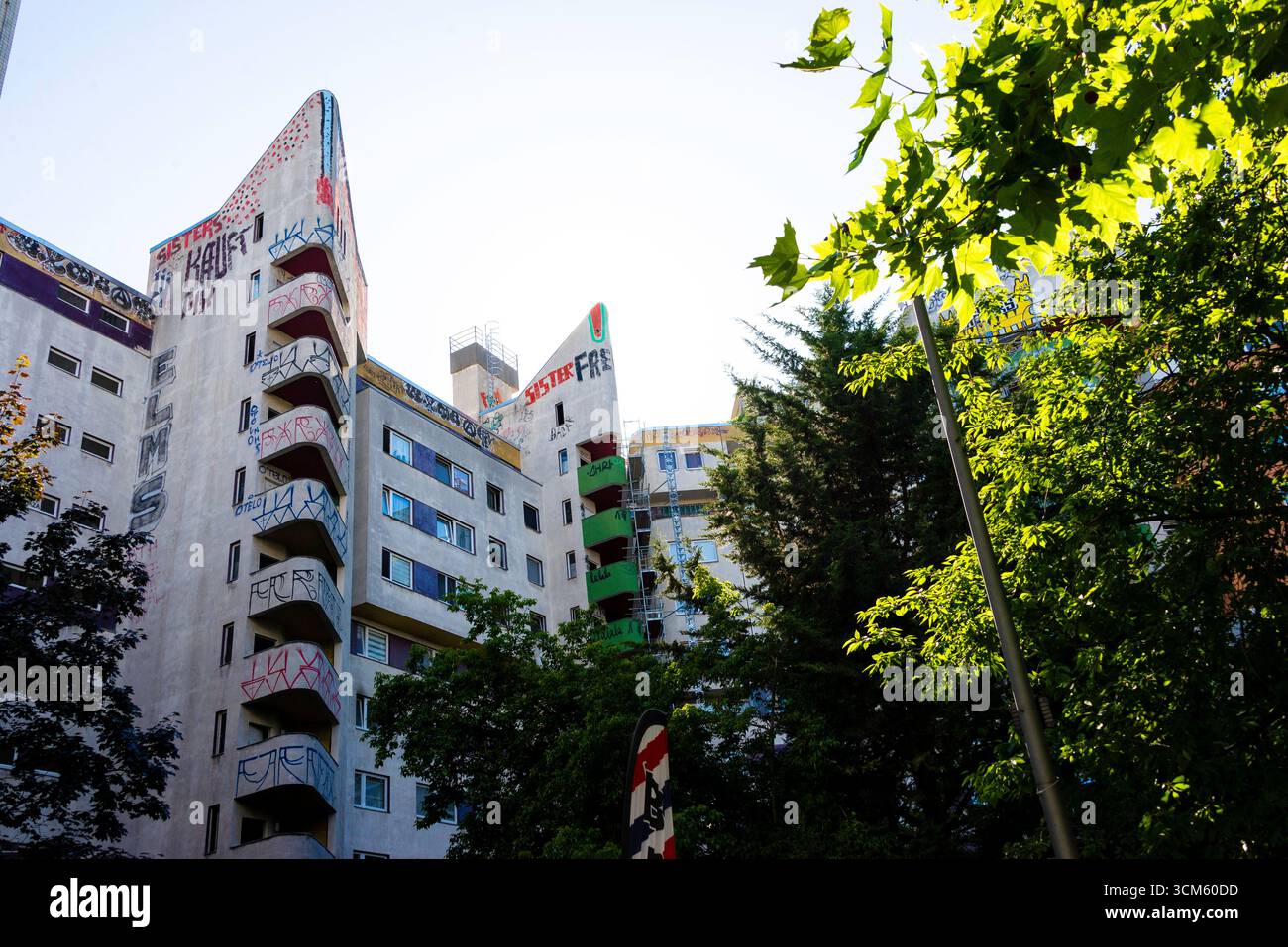 Unique, graffiti-covered postmodern housing at Kottbusser Tor, Berlin ...