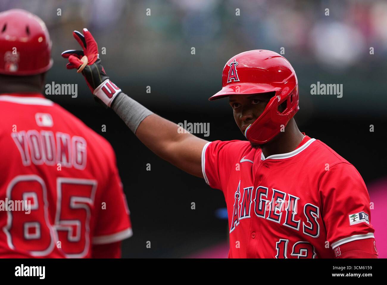Los Angeles Angels' Denzer Guzman reacts after his first Major League ...