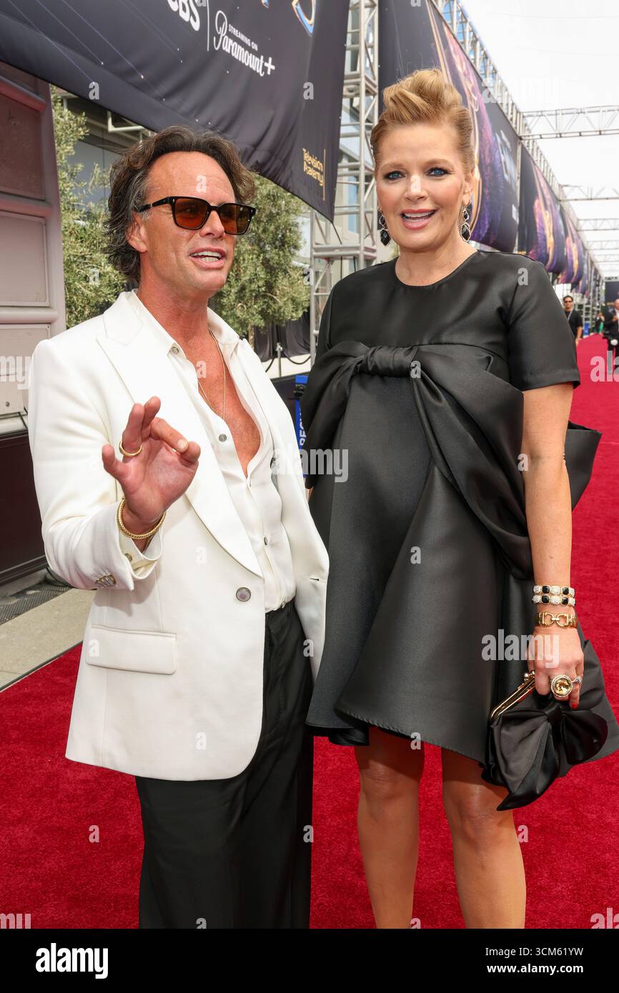 Walter Goggins, from left, Melissa Peterman walk the red carpet at the ...