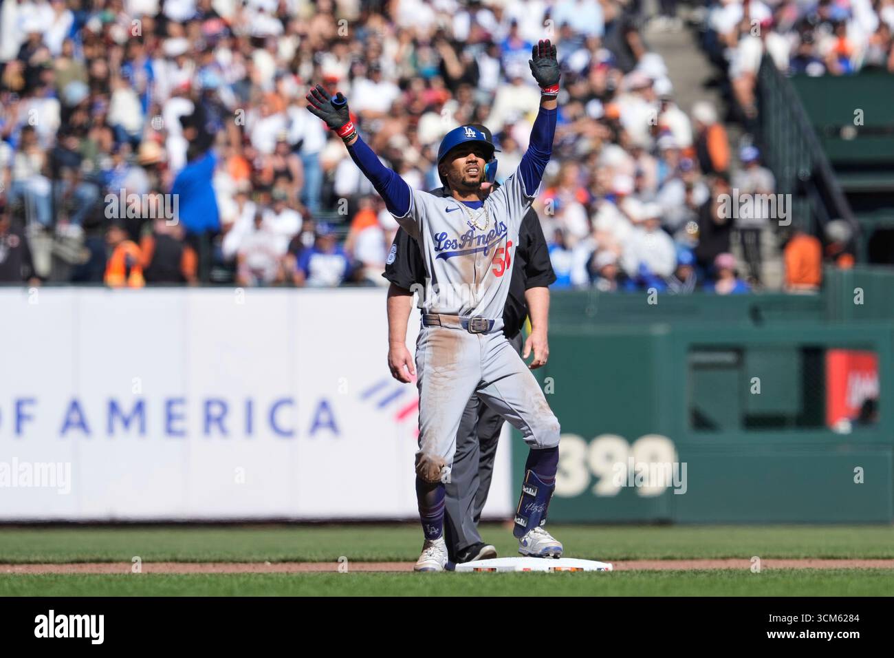 Los Angeles Dodgers' Mookie Betts reacts after hitting a double during ...