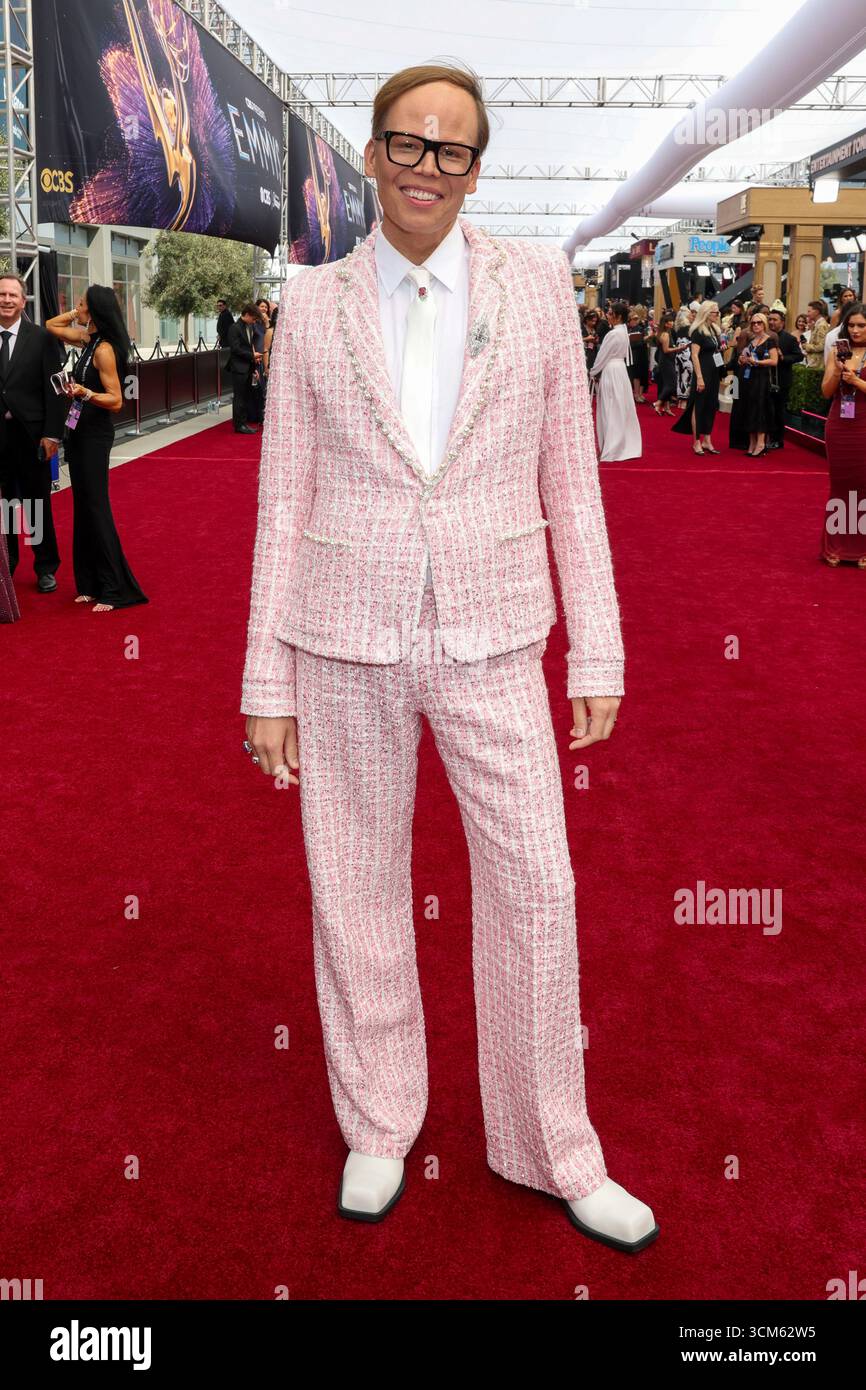 Jeff Hiller walks the red carpet at the 77th Emmy Awards on Sunday ...