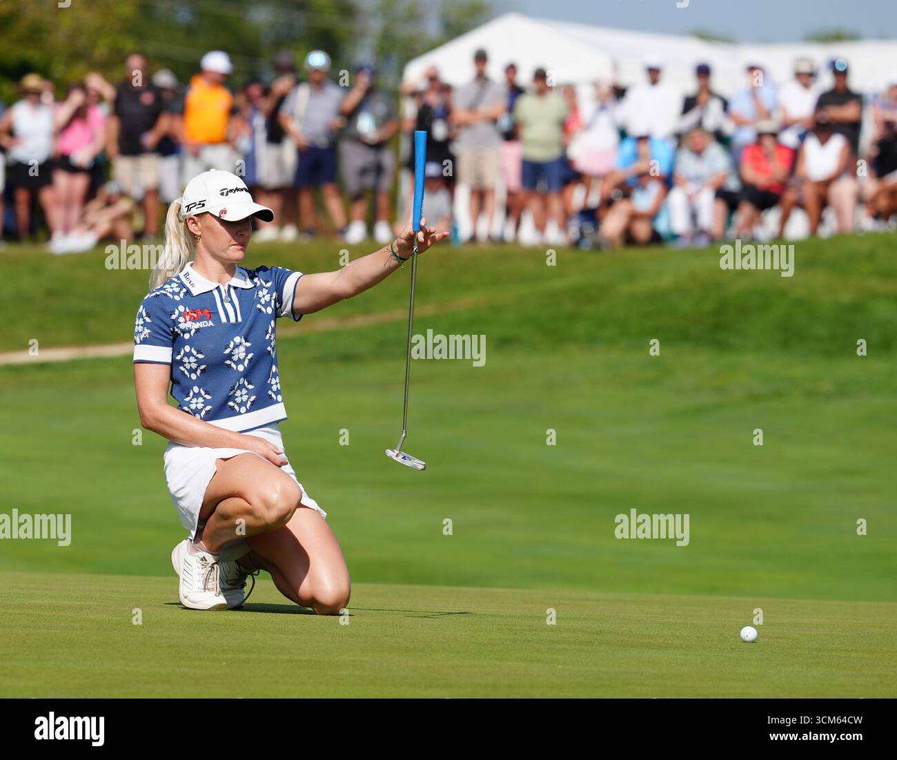 MAINEVILLE, OH - SEPTEMBER 14: LPGA golfer Charley Hull lines up the winning birdie putt on the ...