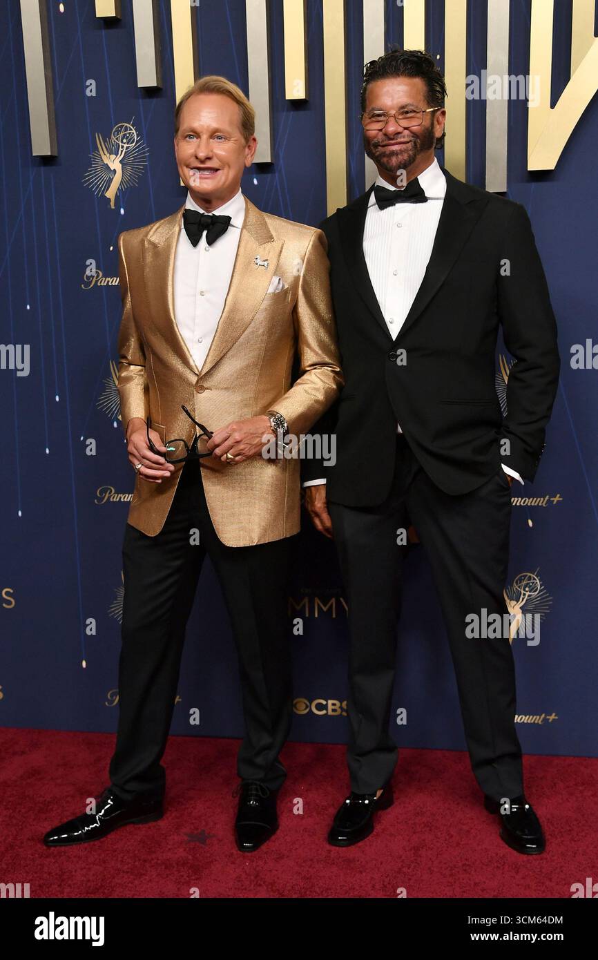 Carson Kressley, left, and John Guerrera arrive at the 77th Primetime ...