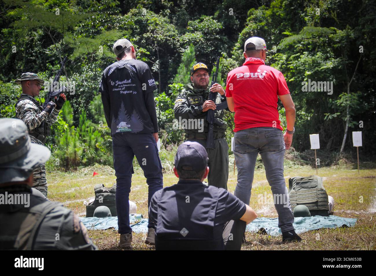 A military instructor gives orders to a group of soldiers during the ...