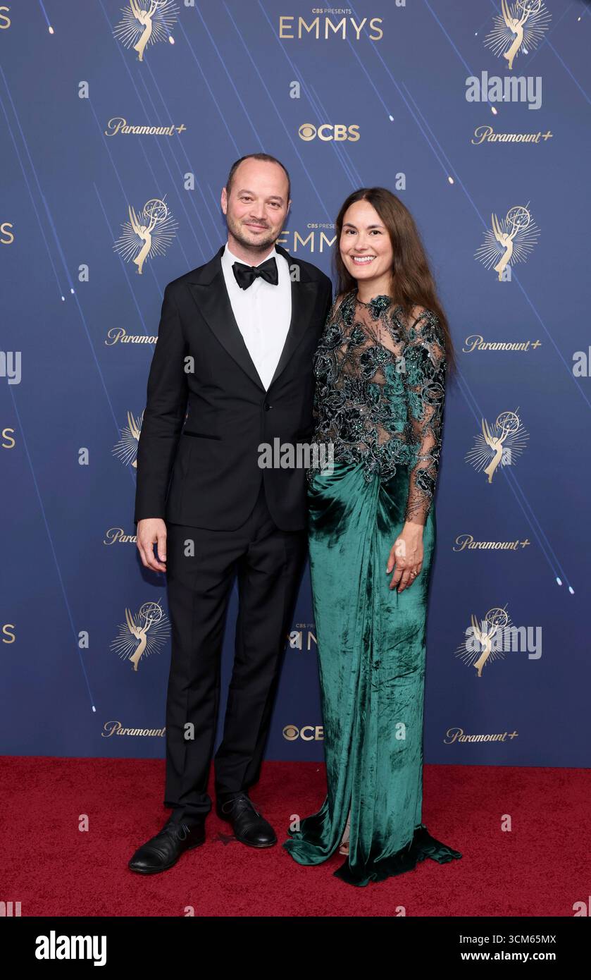 Julian Stevens, left, and Hannah John-Kamen arrive at the 77th Emmy ...