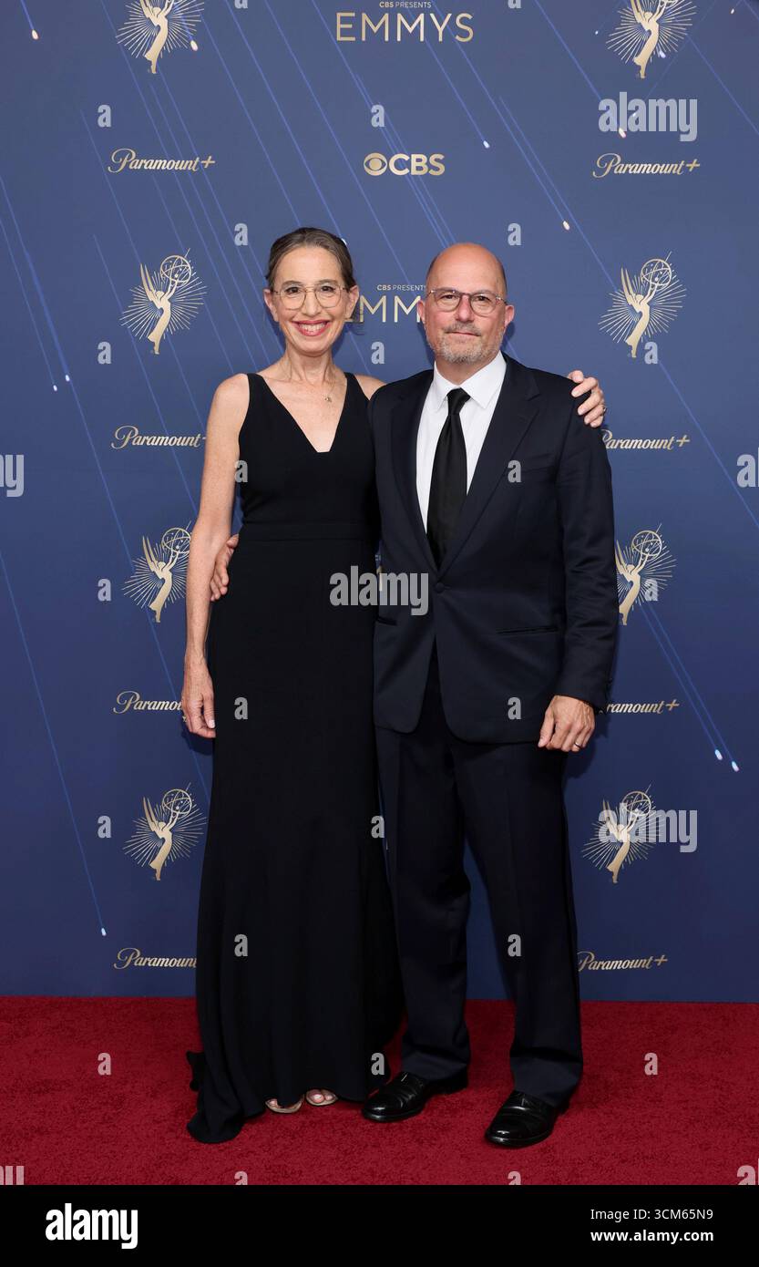 Caroline Baron, left, and Anthony Weintraub arrive at the 77th Emmy ...