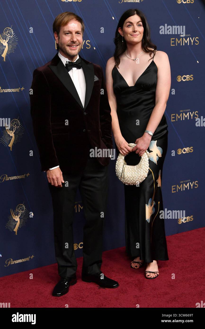 John McCutcheon, left, and Breannah Gibson arrive at the 77th Primetime ...