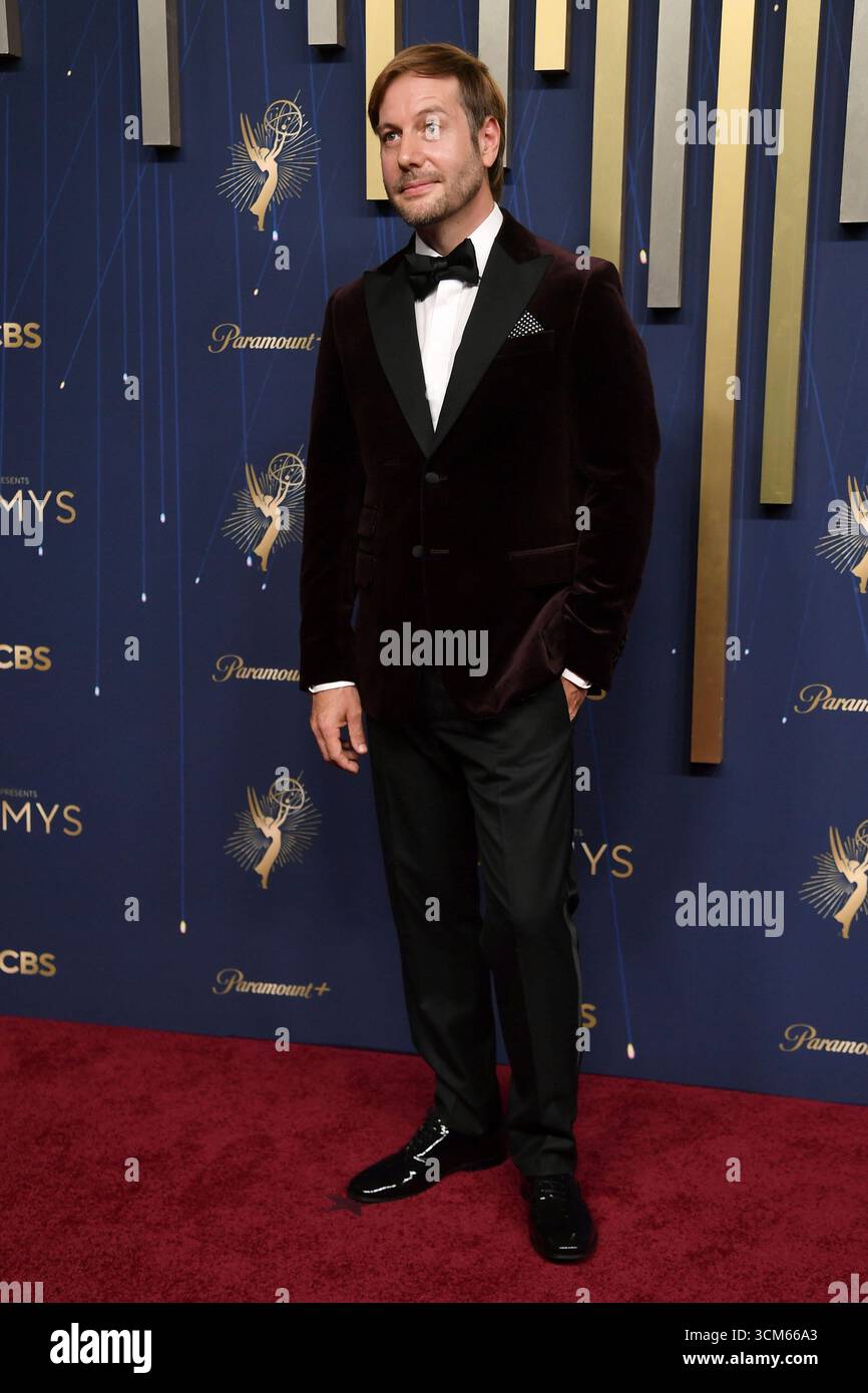 John McCutcheon arrives at the 77th Primetime Emmy Awards on Sunday ...
