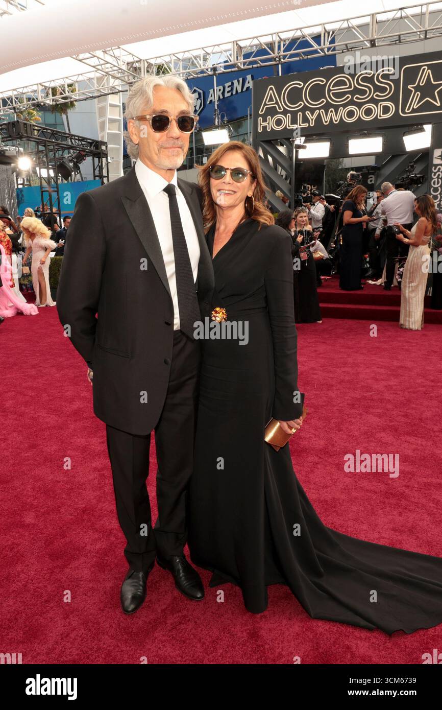 Tony Gilroy, left, and Susan Gilroy walk the red carpet at the 77th ...