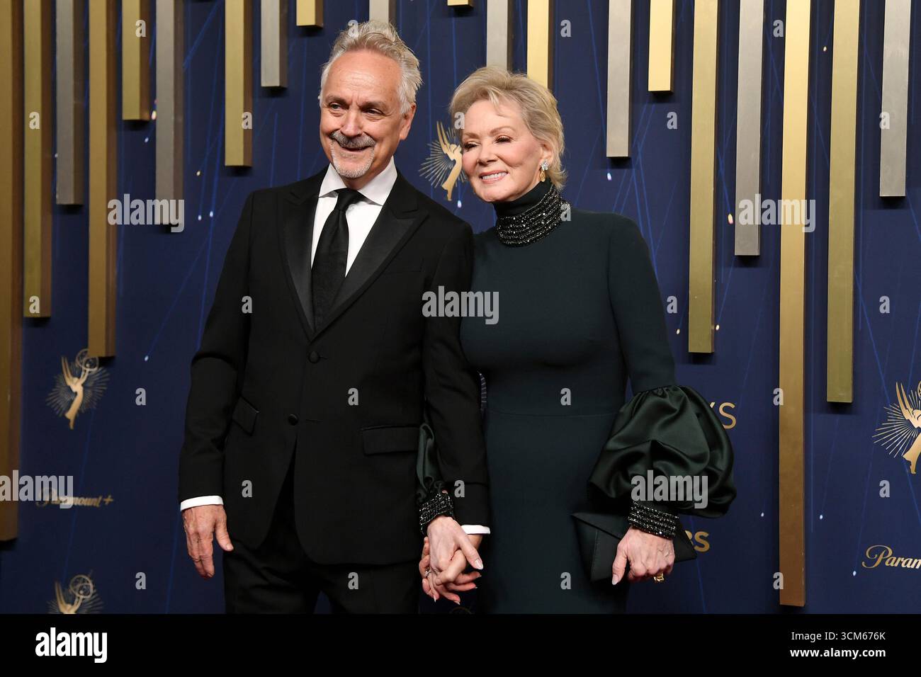 Joe Pacheco, left and Jean Smart arrive at the 77th Primetime Emmy ...