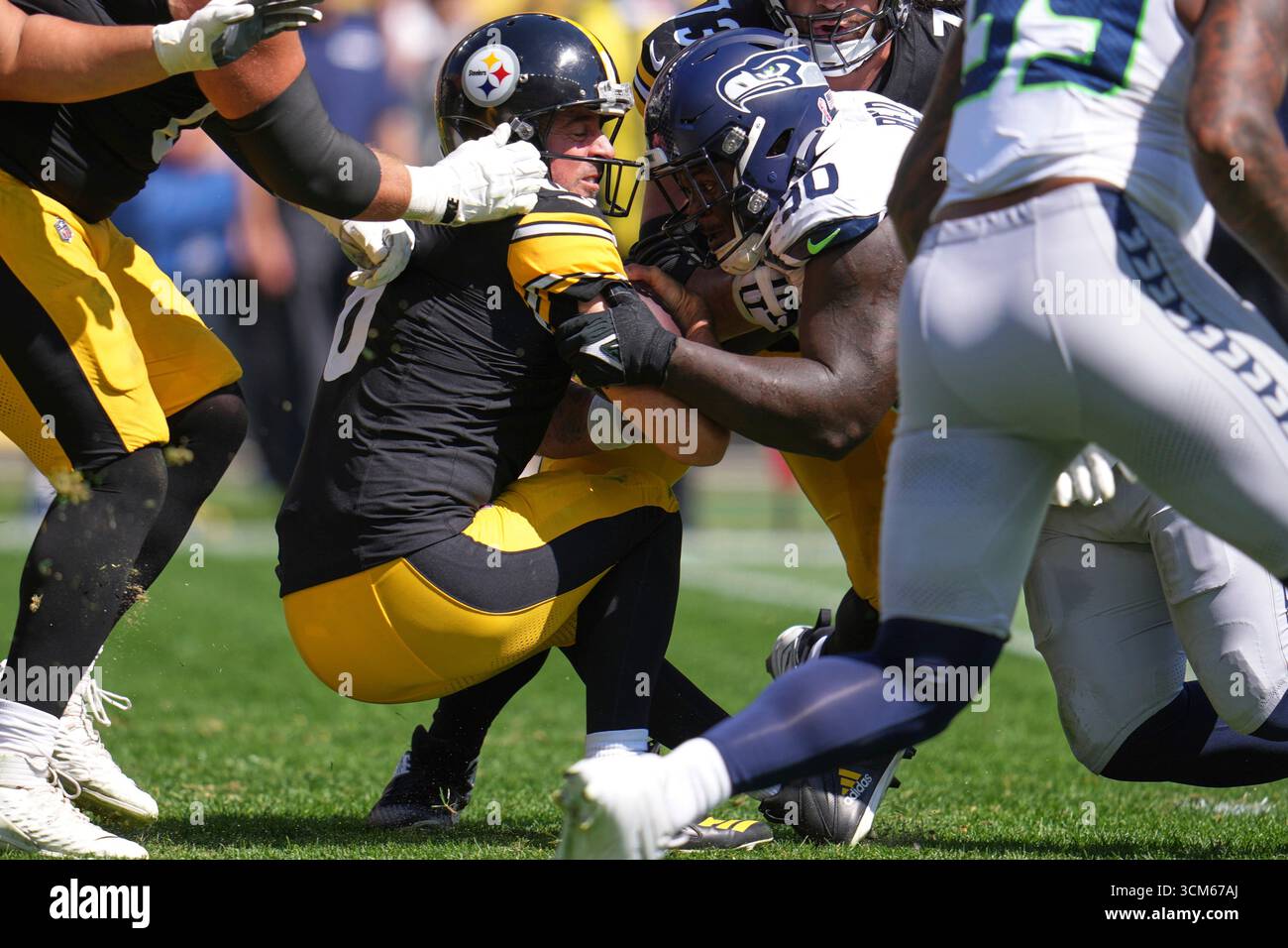 Pittsburgh Steelers quarterback Aaron Rodgers (8) is sacked by Seattle ...