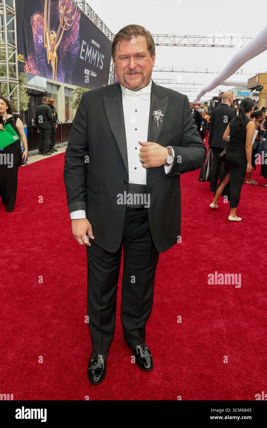 Michael Chernus walks the red carpet at the 77th Emmy Awards on Sunday ...