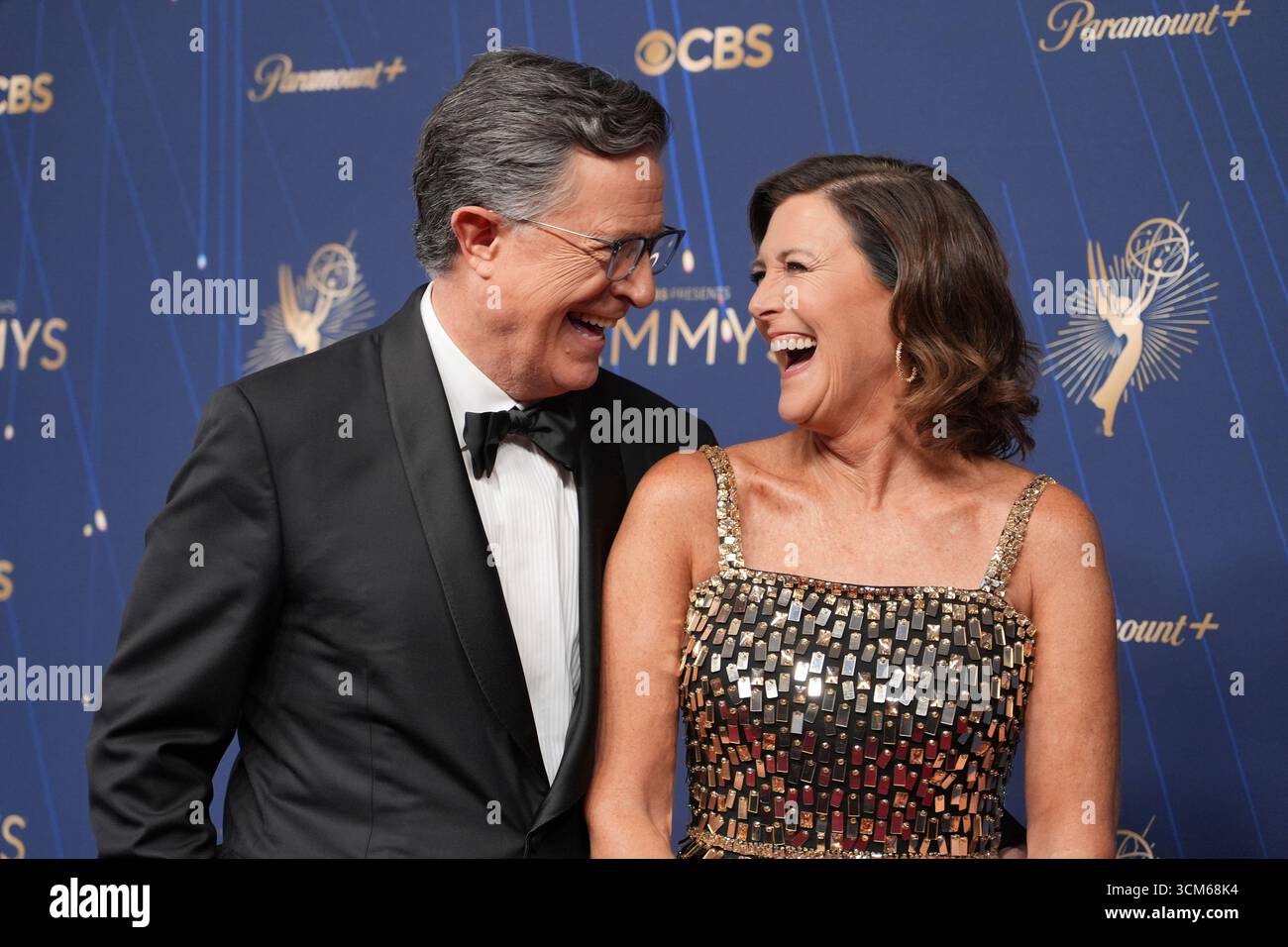 Stephen Colbert, left, and Evelyn McGee-Colbert arrive at the 77th ...