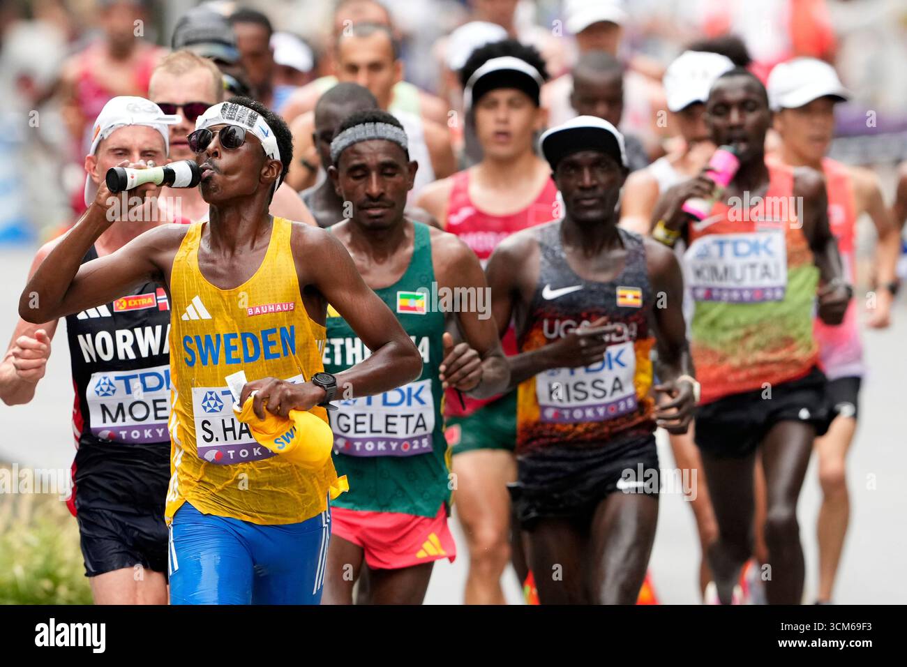 Sweden's Suldan Hassan drinks as he competes in the men's marathon at ...