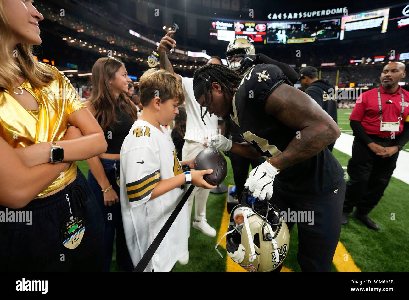 New Orleans Saints running back Velus Jones Jr. (13) signs autographs ...