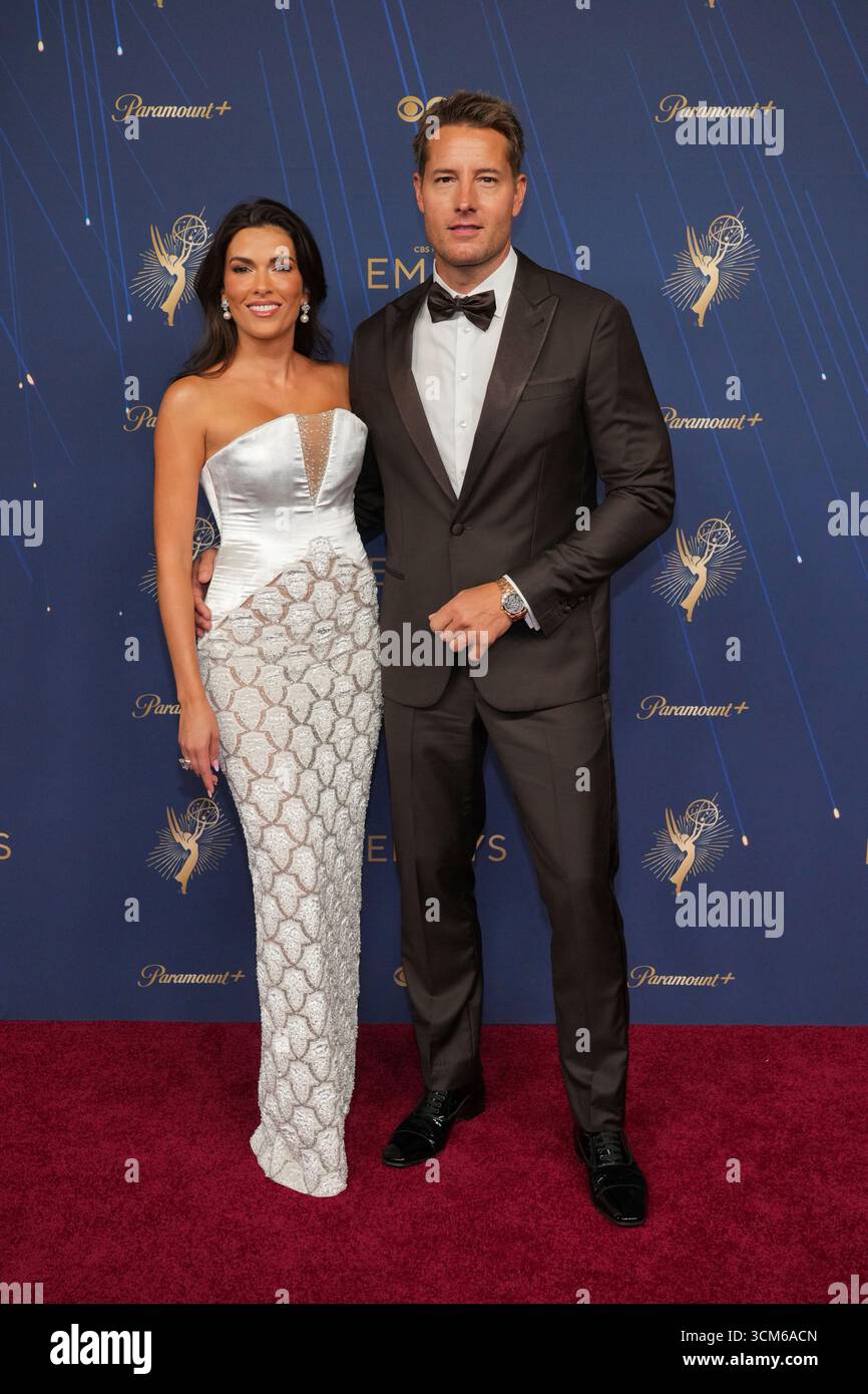 Sofia Pernas, left, and Justin Hartley arrive at the 77th Emmy Awards on Sunday, Sept. 14, 2025 ...