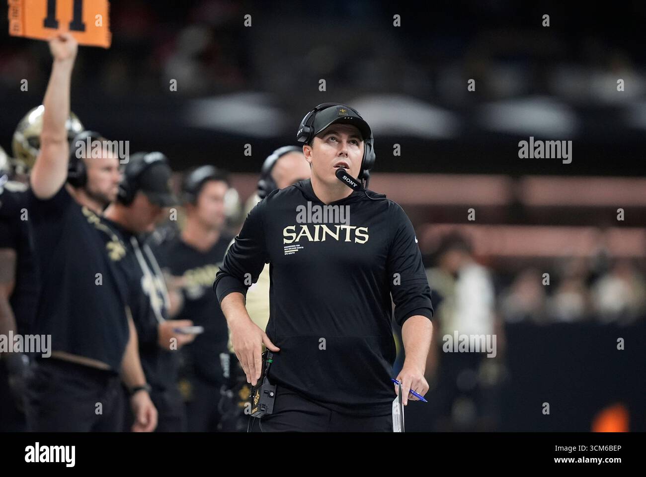 New Orleans Saints head coach Kellen Moore walks on the sideline in the ...