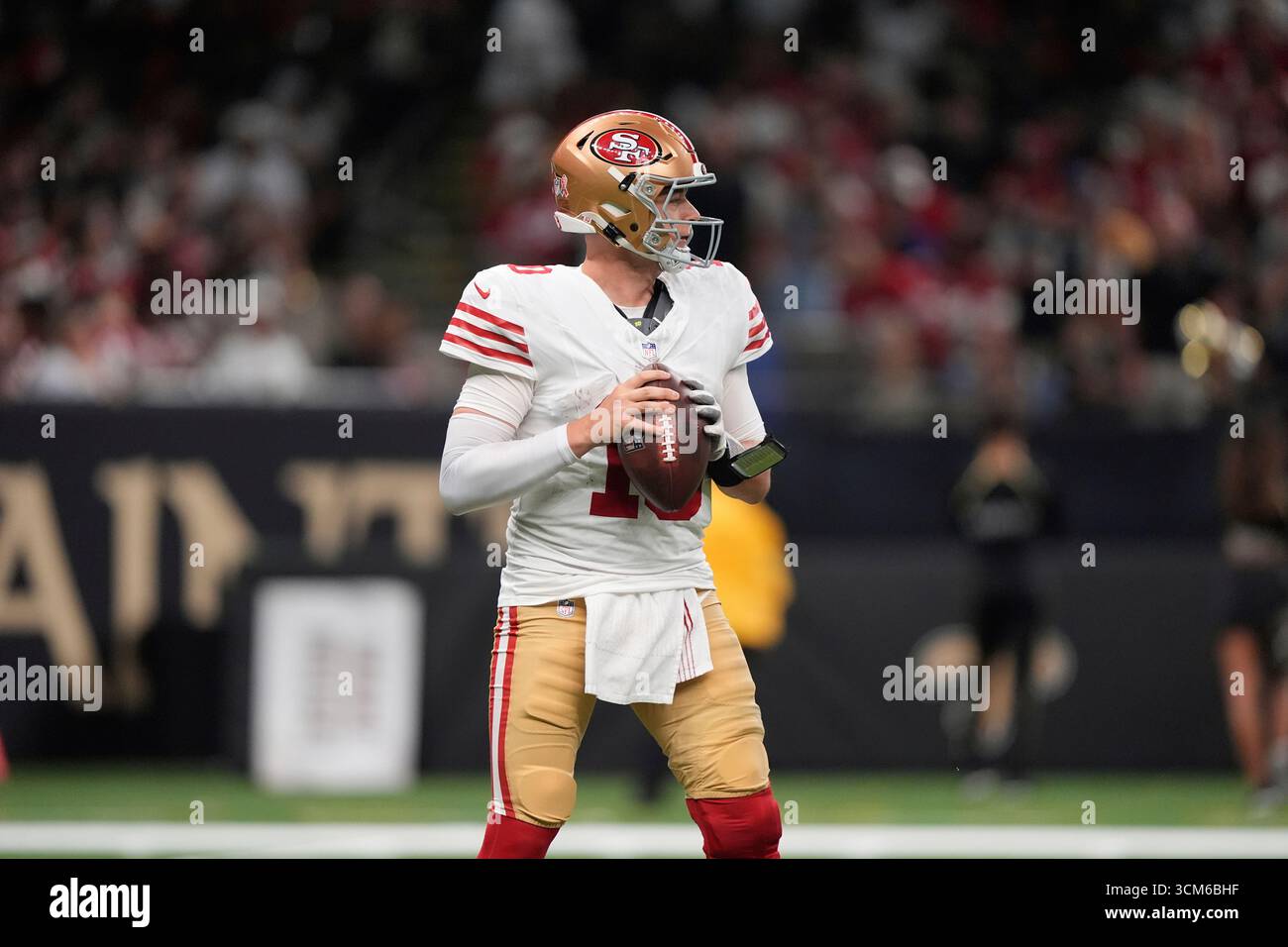 San Francisco 49ers quarterback Mac Jones (10) drops back in the first ...