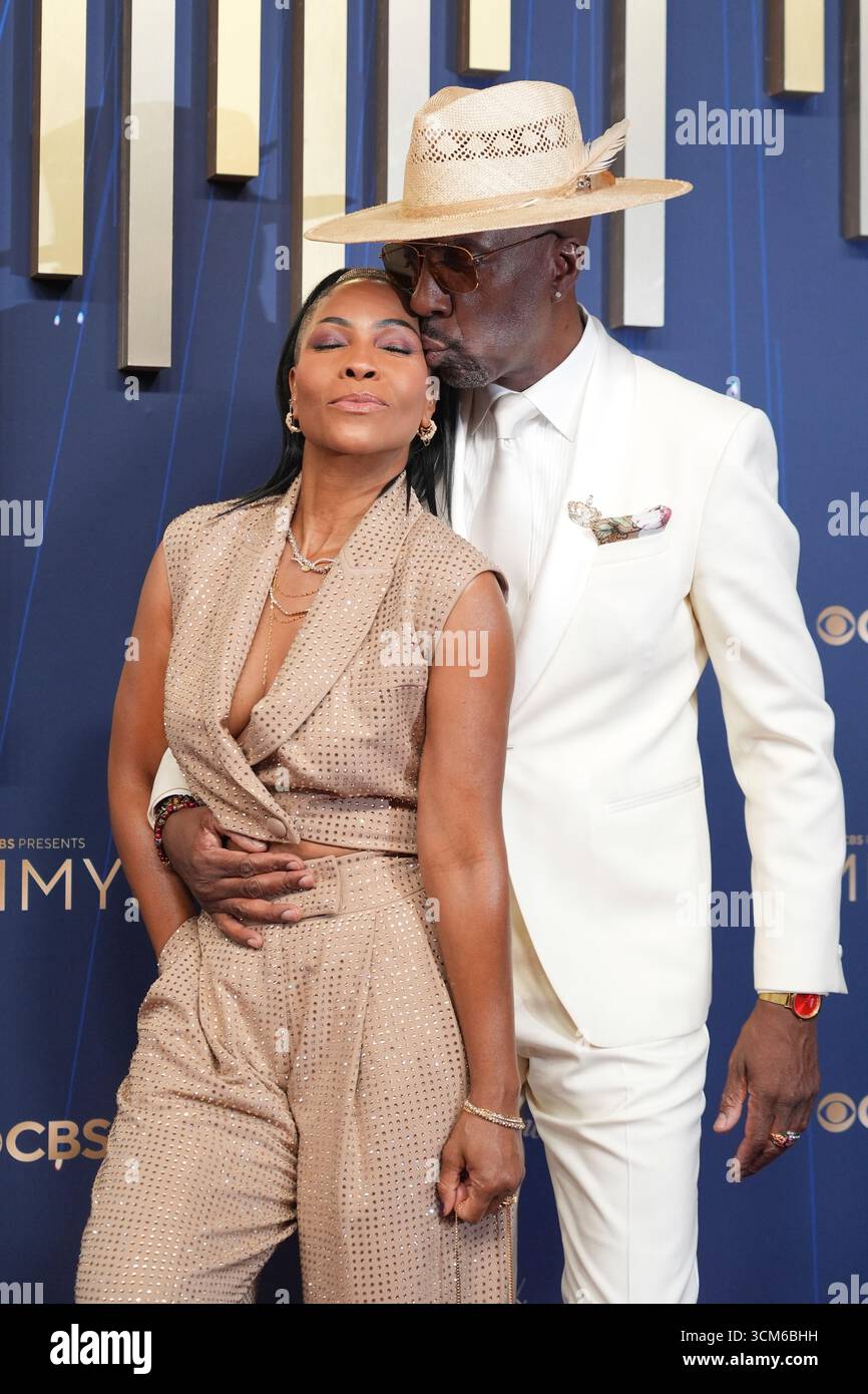 Shahidah Omar, left, and J. B. Smoove arrive at the 77th Primetime Emmy ...