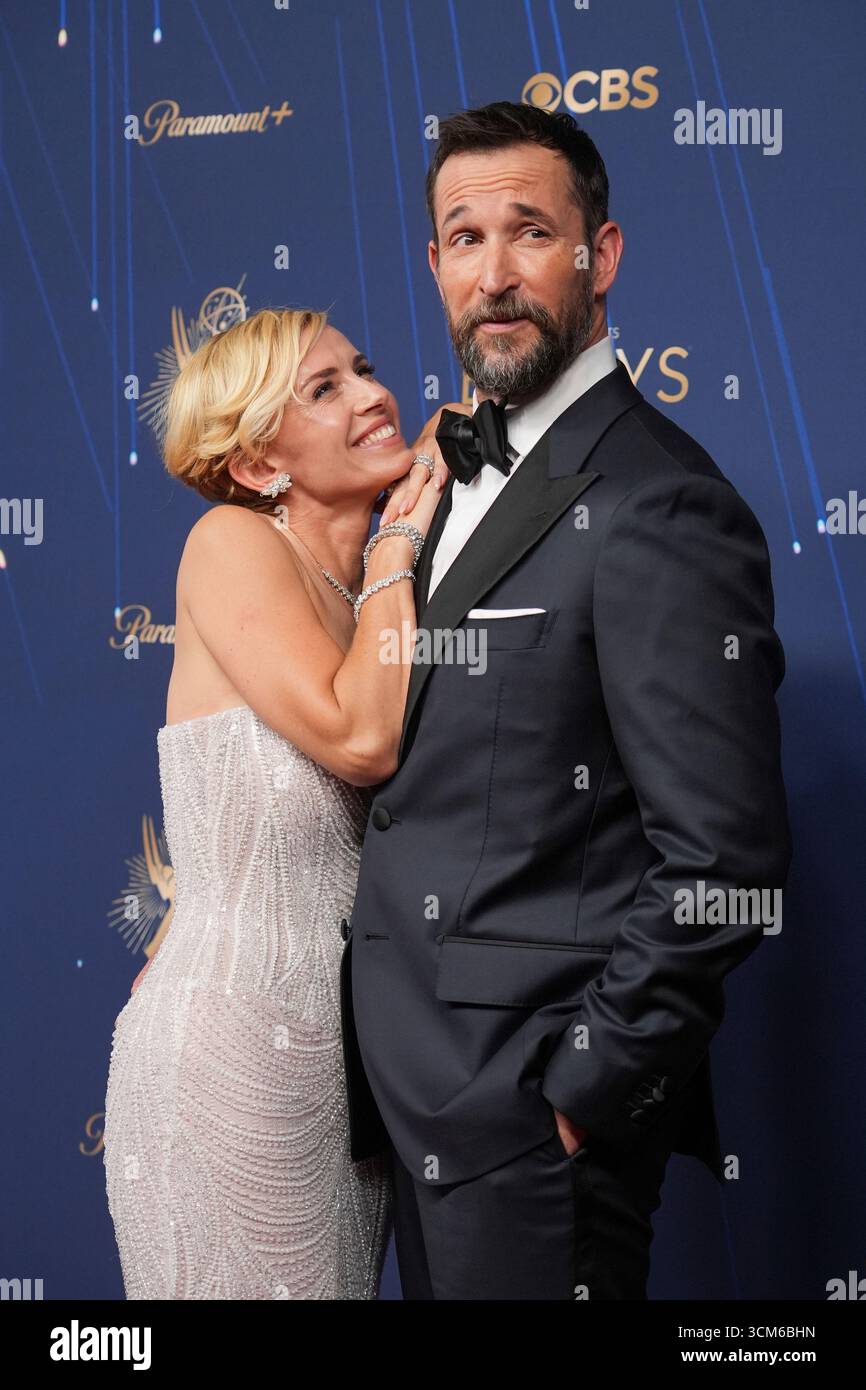 Sara Wells, left, and Noah Wyle arrive at the 77th Primetime Emmy ...