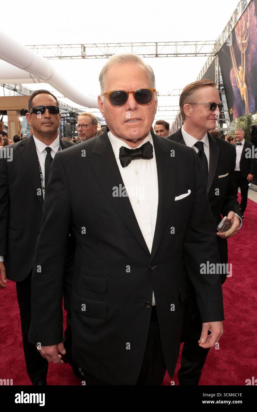 David Zaslav, center, walks the red carpet at the 77th Emmy Awards on ...