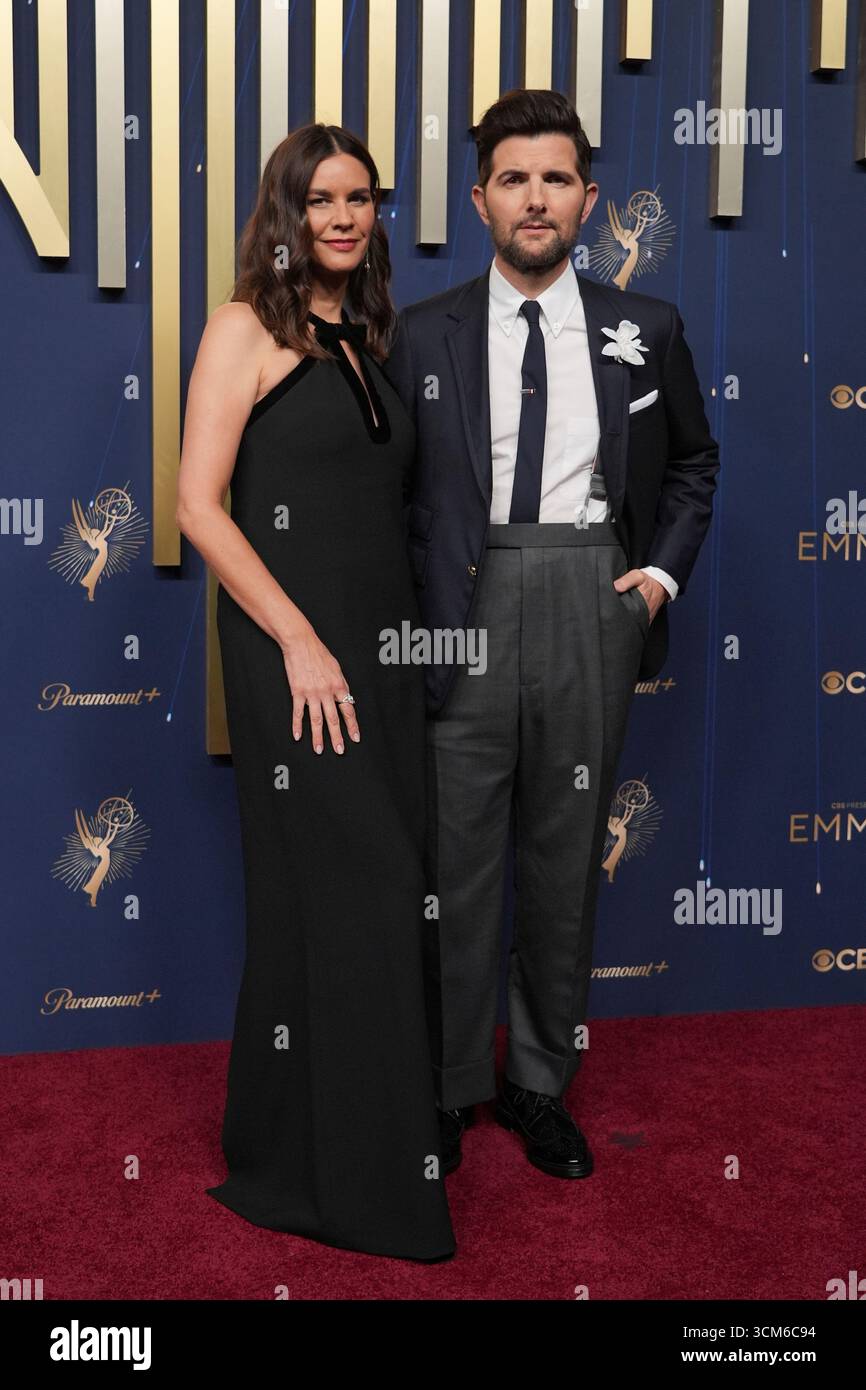 Naomi Scott, left, and Adam Scott arrive at the 77th Primetime Emmy Awards on Sunday, Sept. 14 ...