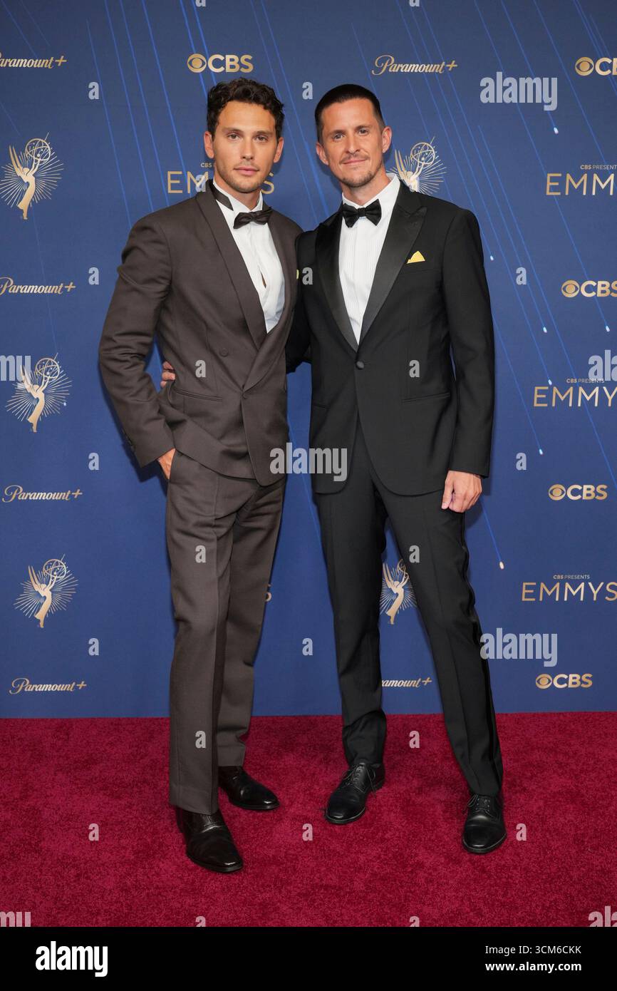 Cooper Koch, left, and Stuart McClave arrive at the 77th Emmy Awards on ...