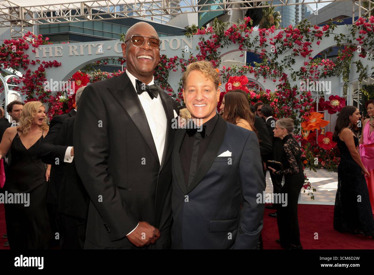 Randall Winston, left, and walks the red carpet at the 77th Emmy Awards ...