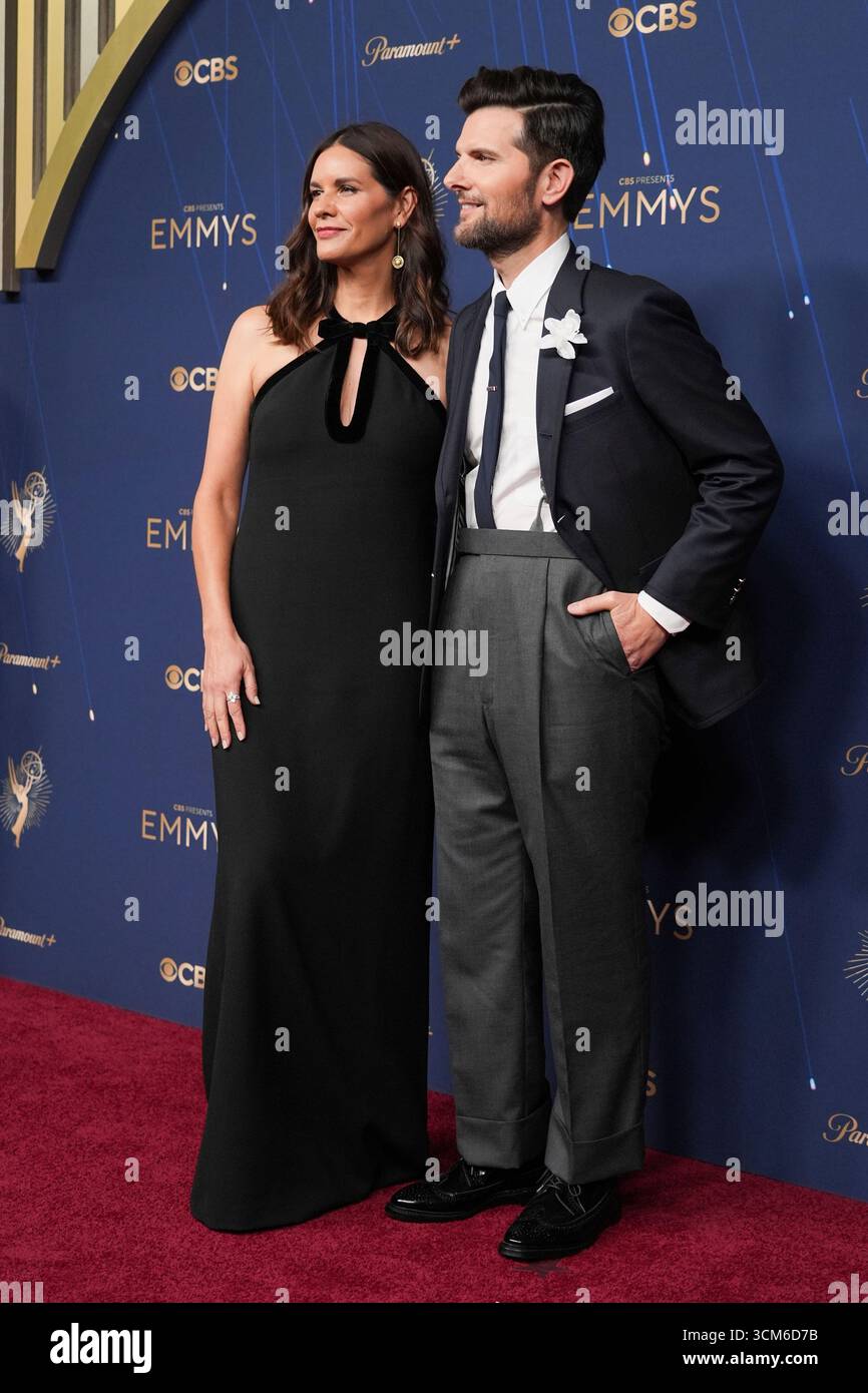 Naomi Scott, left, and Adam Scott arrive at the 77th Primetime Emmy Awards on Sunday, Sept. 14 ...