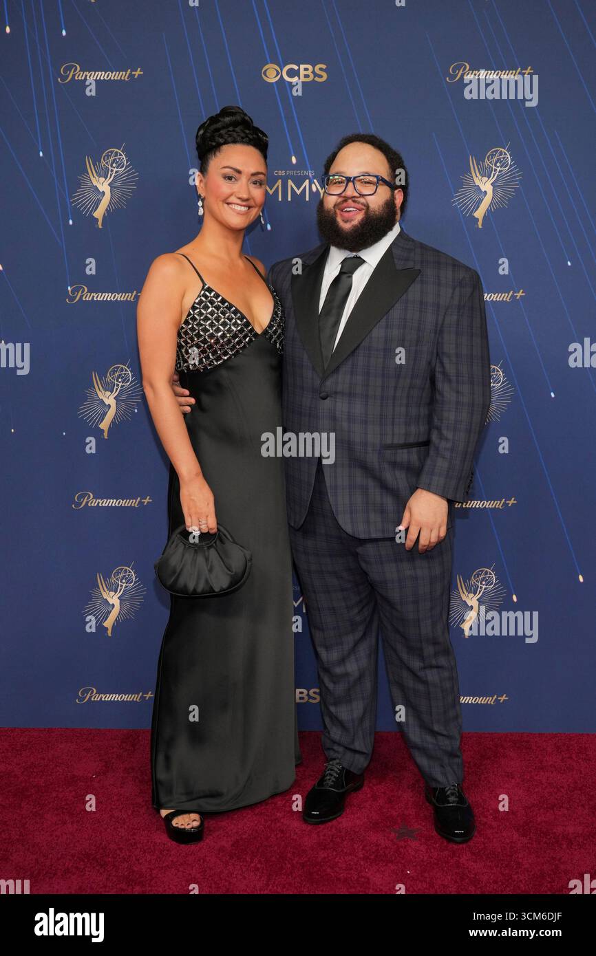 Anabella Cherry Left And Zach Cherry Arrive At The 77th Emmy Awards Anabella Cherry Left And Zach Cherry Arrive At The 77th Emmy Awards
