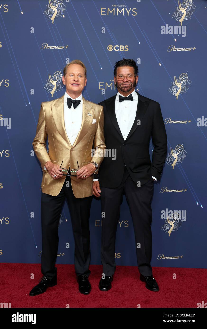 Carson Kressley, left, John Guerrera arrive at the 77th Emmy Awards on ...