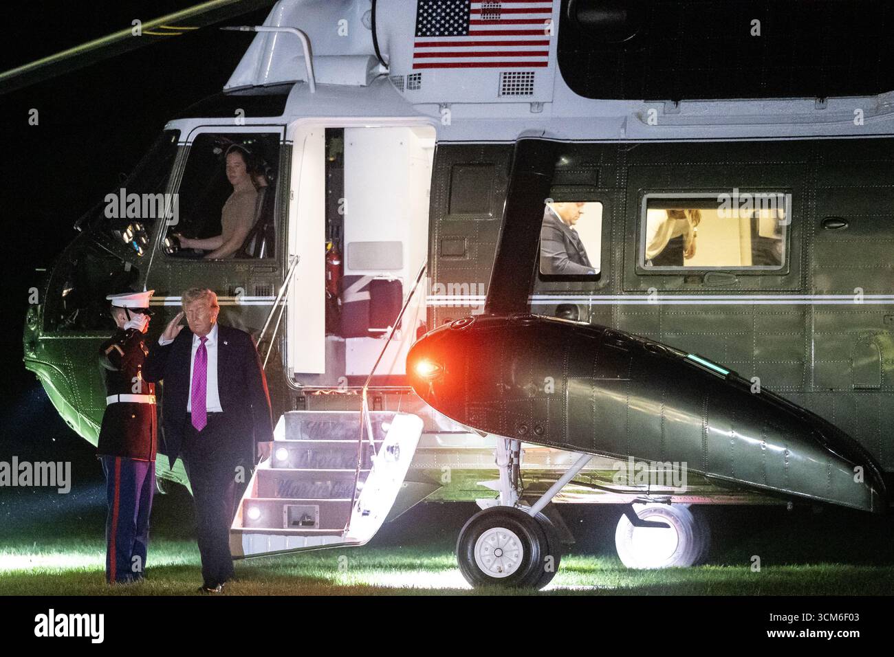 President Donald Trump disembarks from Marine One as he arrives on the ...