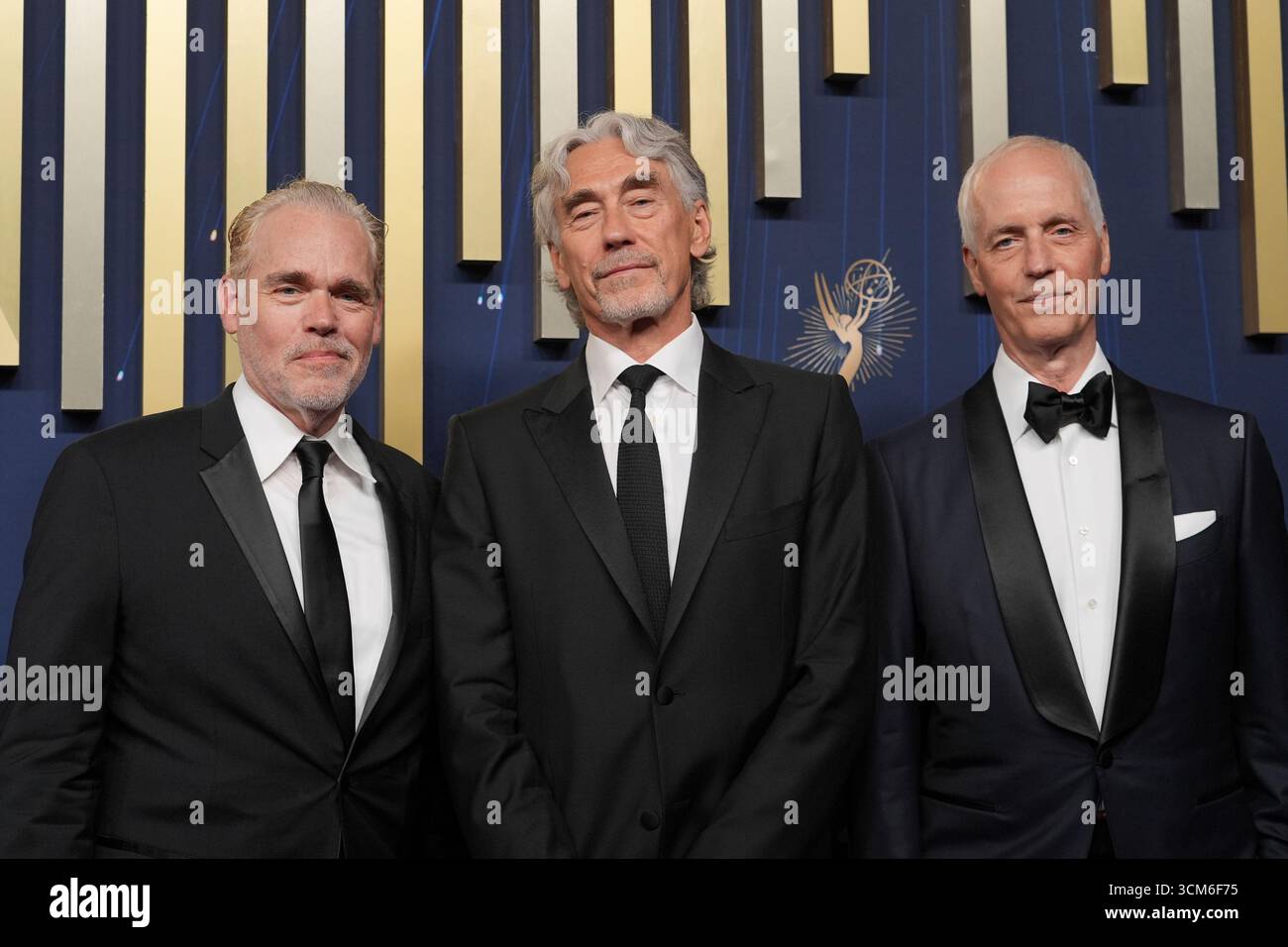 John Gilroy, from left, Tony Gilroy, and Dan Gilroy arrive at the 77th ...