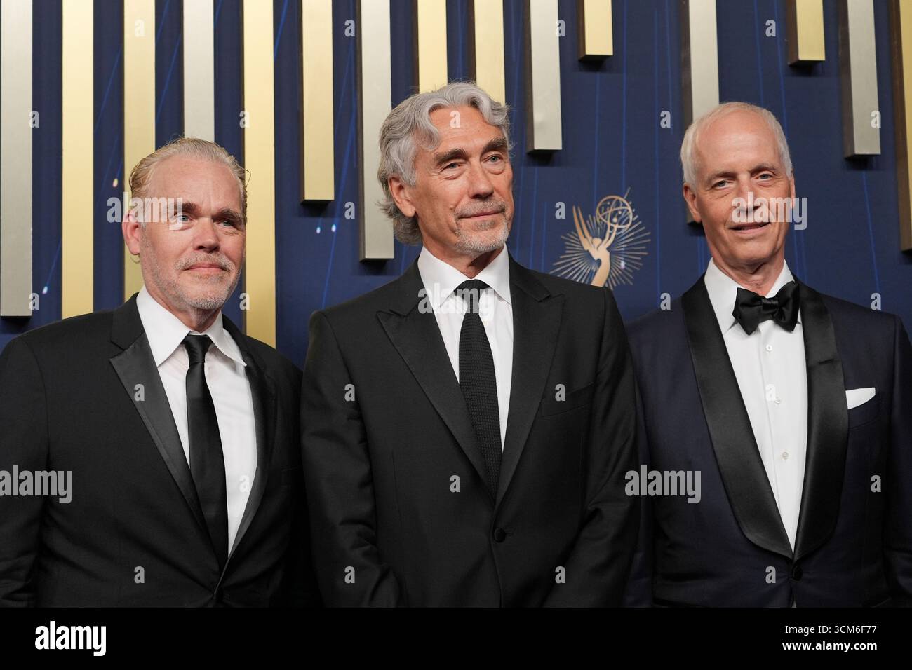 John Gilroy, from left, Tony Gilroy, and Dan Gilroy arrive at the 77th ...